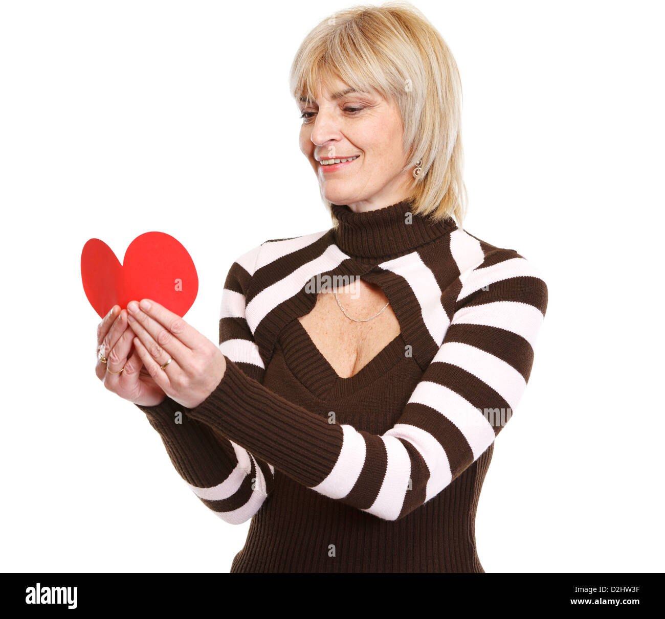 Happy mature woman reading heart shaped postcard Stock Photo - Alamy