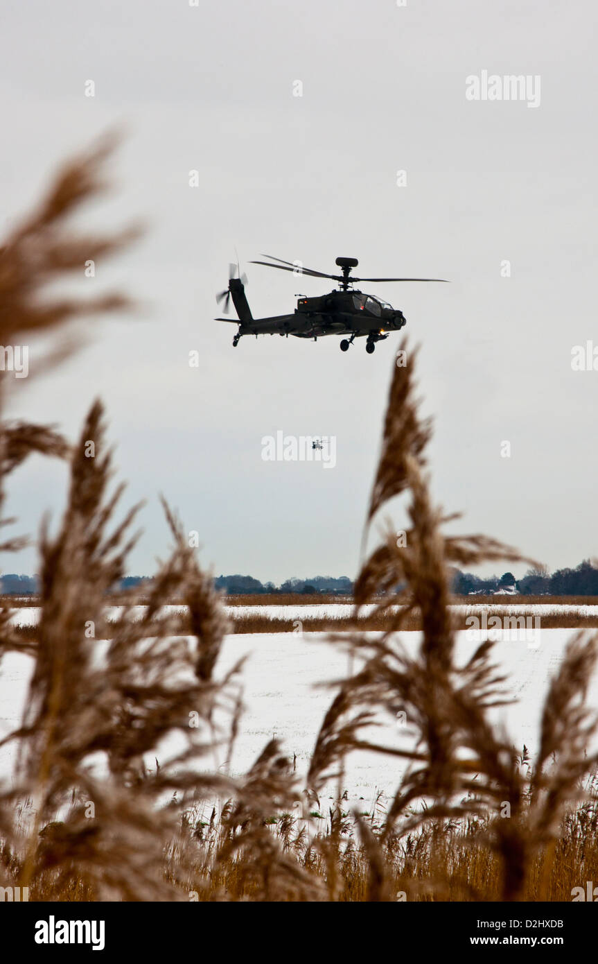 Pair of British Apache helicopter gunship on training flight over ...