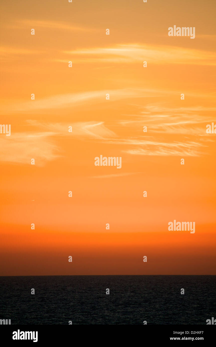 sunset at sea background view Stock Photo - Alamy