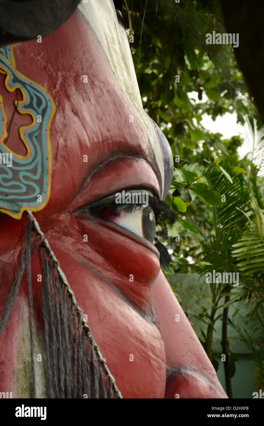 Side view profile with one eye visible from a Chinese mask for god ...