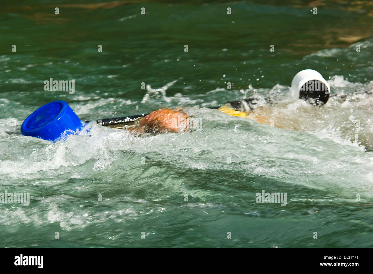 Man struggling with his capsized canoe at the Texas Water Safari canoe ...