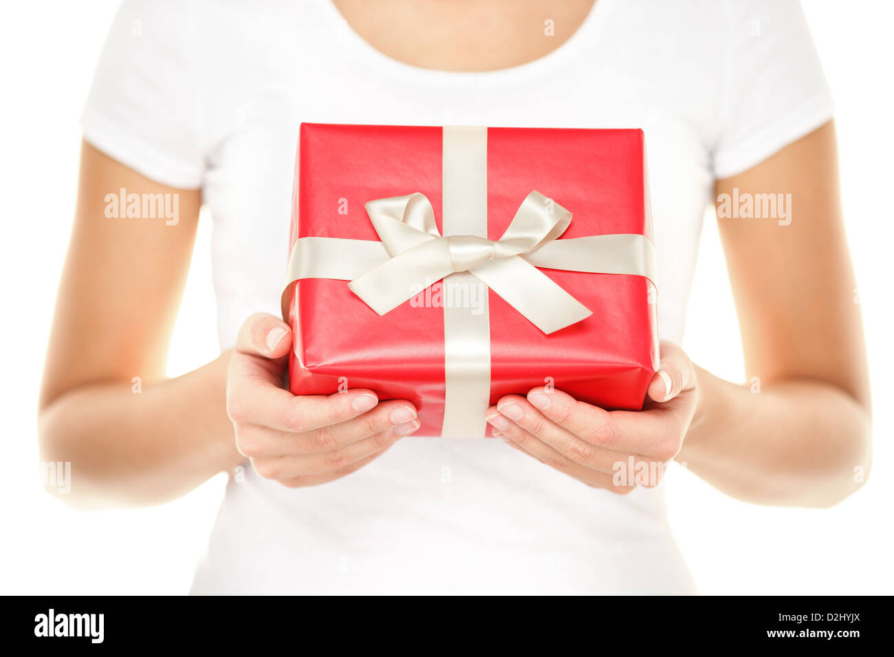 Closeup of female hands showing and giving gifts with red wrapping ...