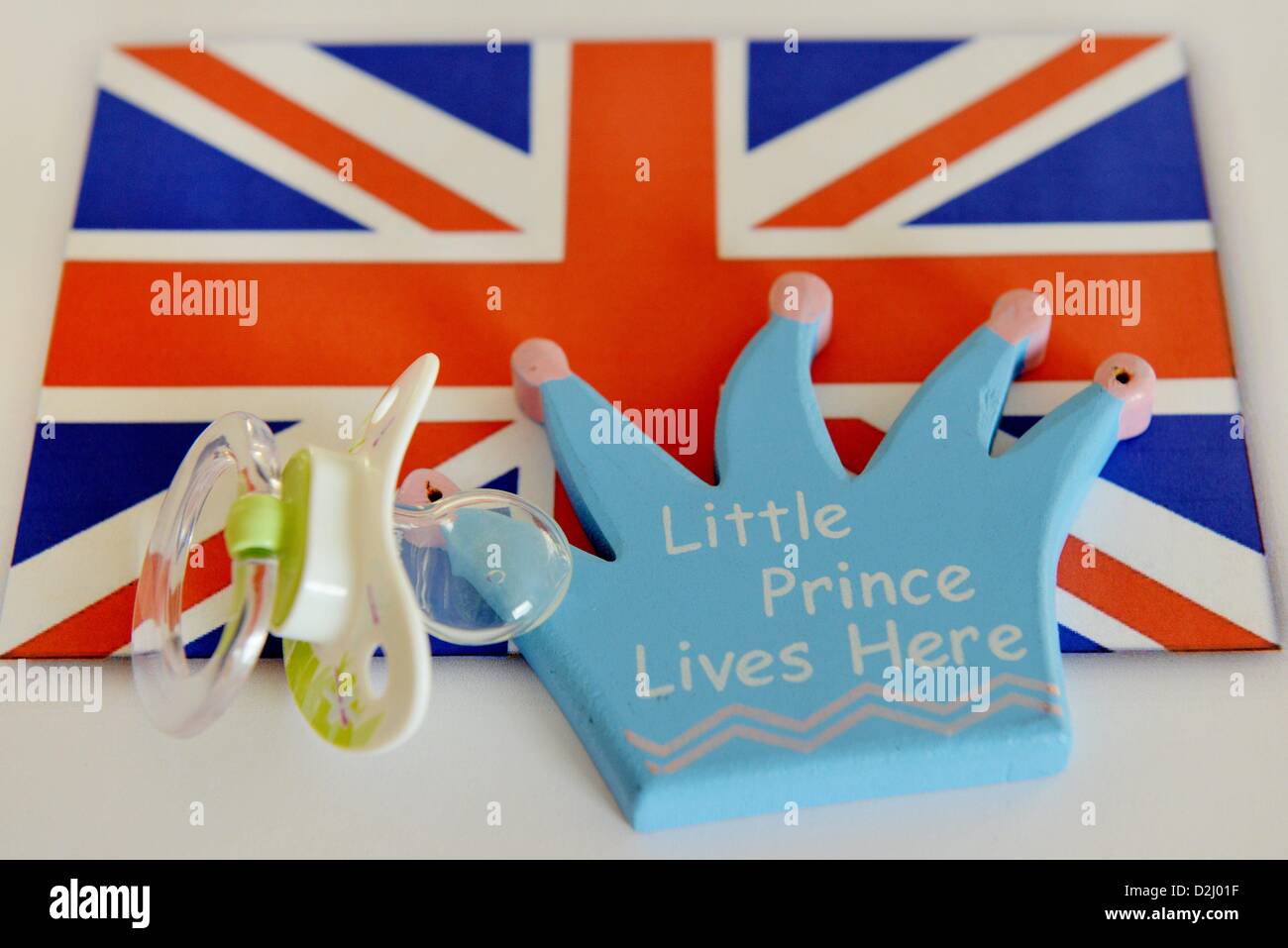 A sign that says "Little Prince lives here" is laying on the Union Jack ...