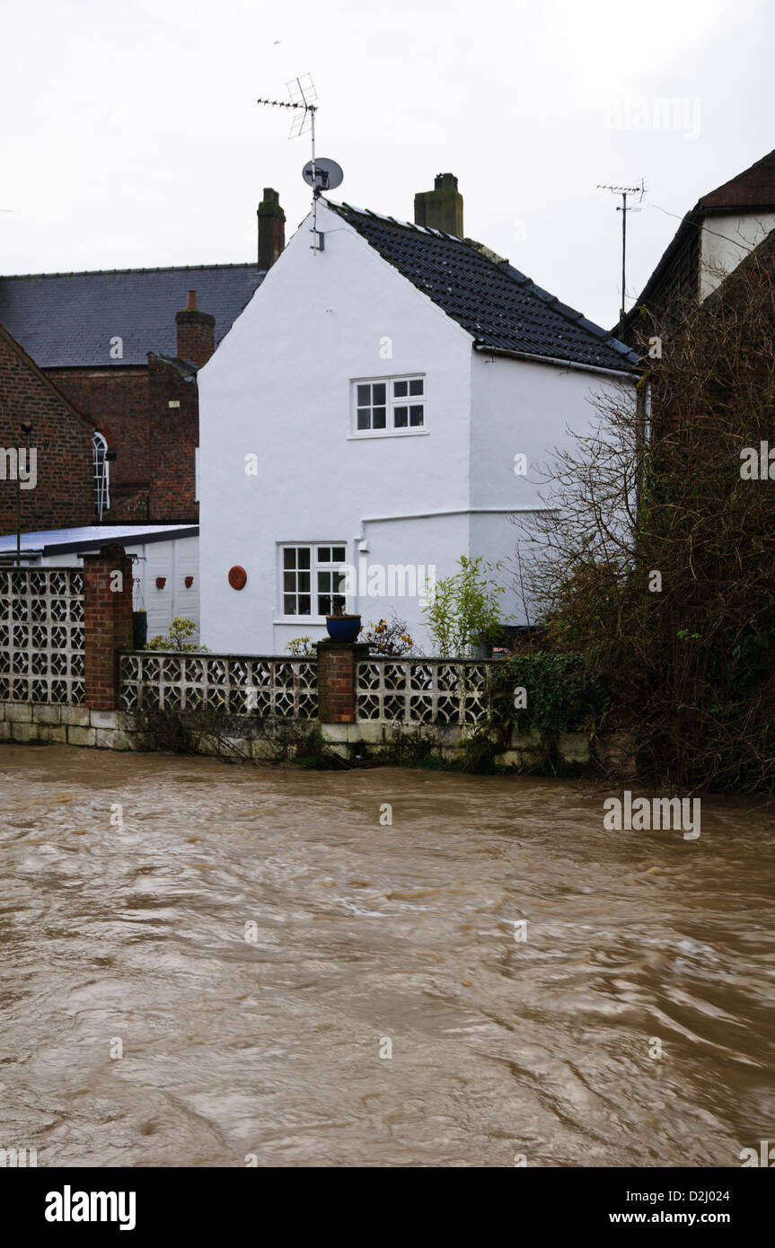 Houses under threat from flood water from Cod Beck, Thirsk Stock Photo ...