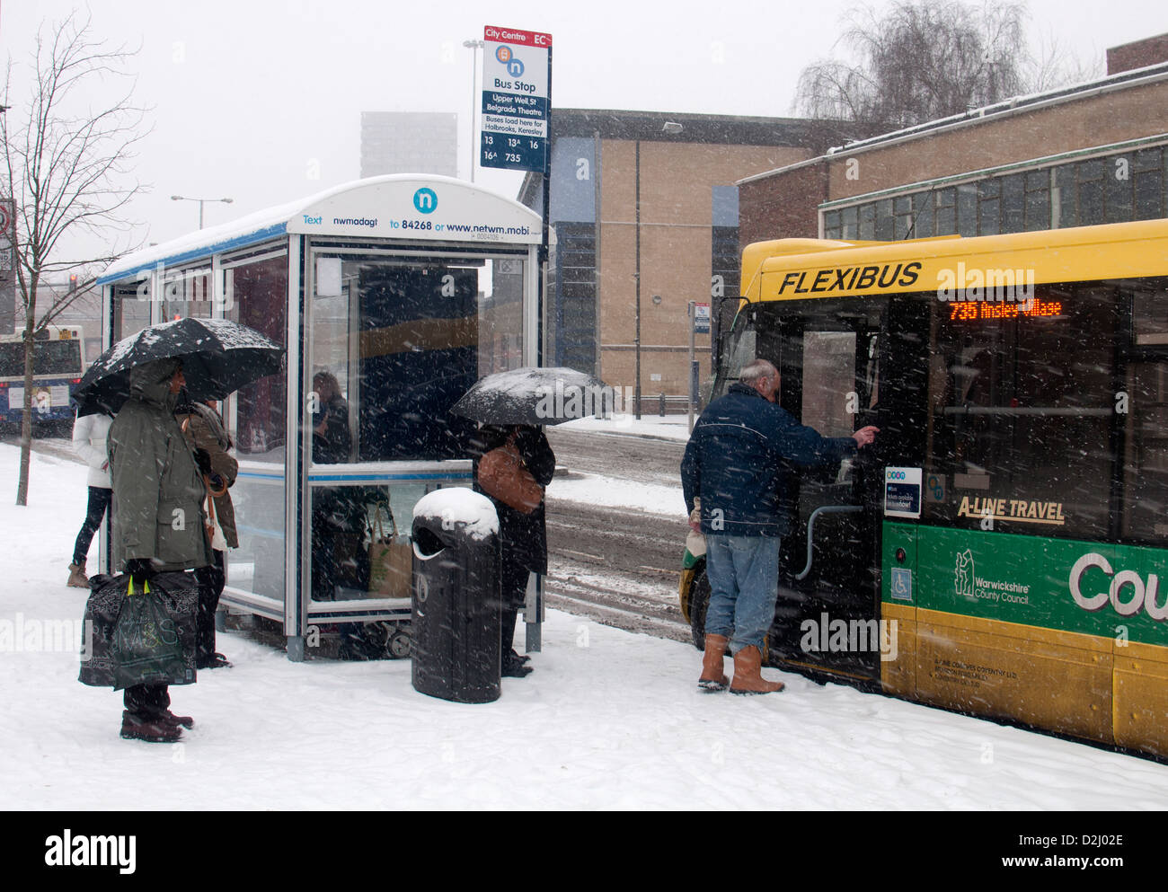 Bus stop in snowy weather, Coventry city centre, UK Stock Photo - Alamy