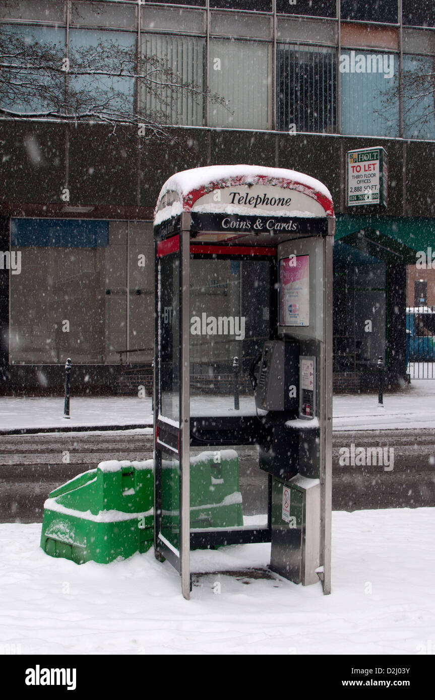 Telephone box in snowy weather, Coventry city centre, UK Stock Photo ...