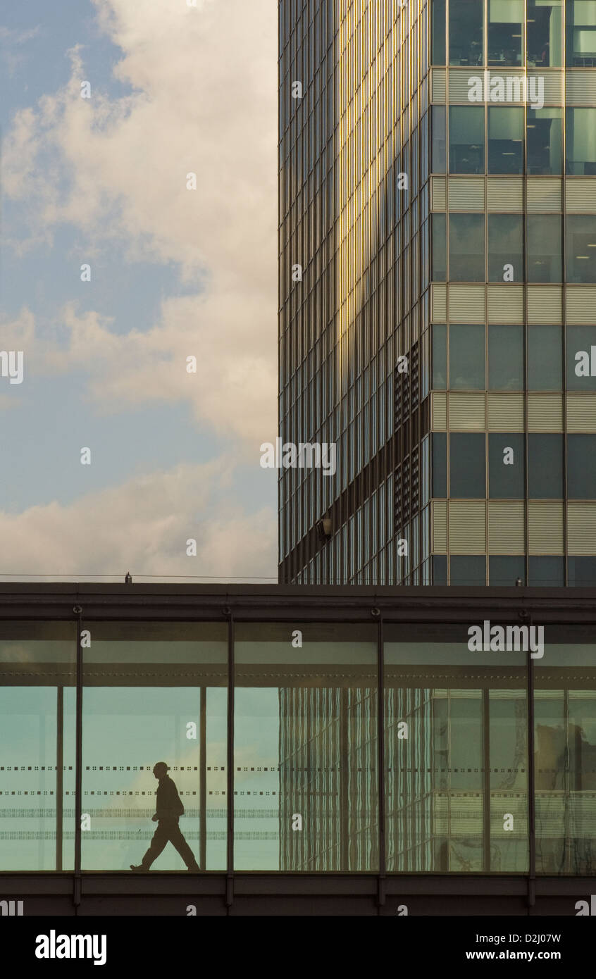 A City worker walking from an office block Stock Photo - Alamy