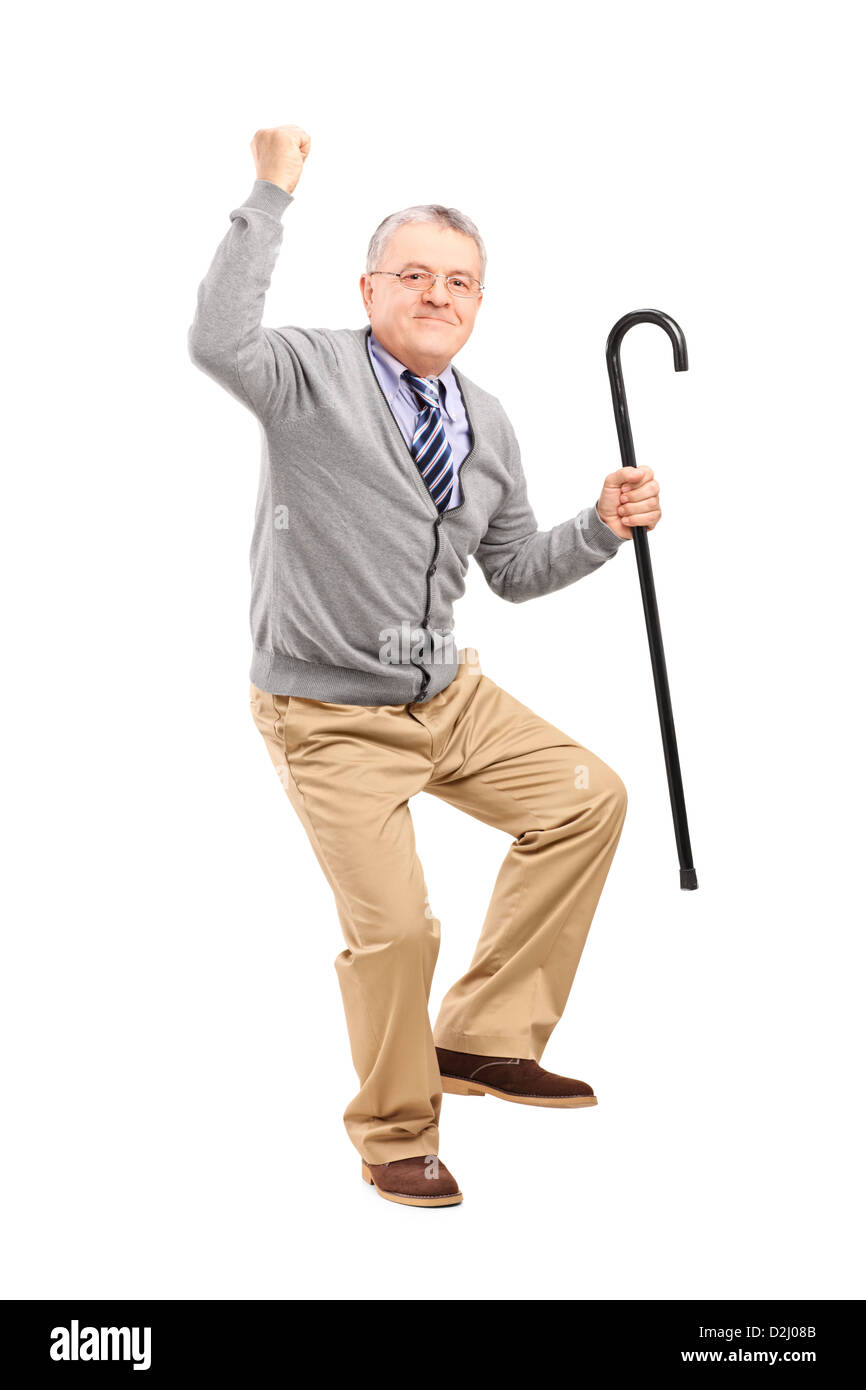 Full length portrait of a happy senior man holding a cane and gesturing ...