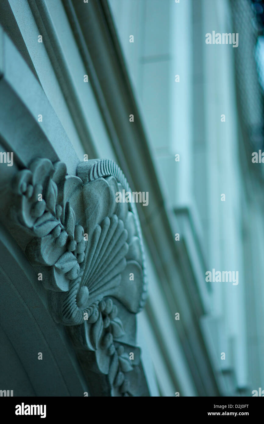 Detail of an ornate architectural floral scroll on exterior of building ...