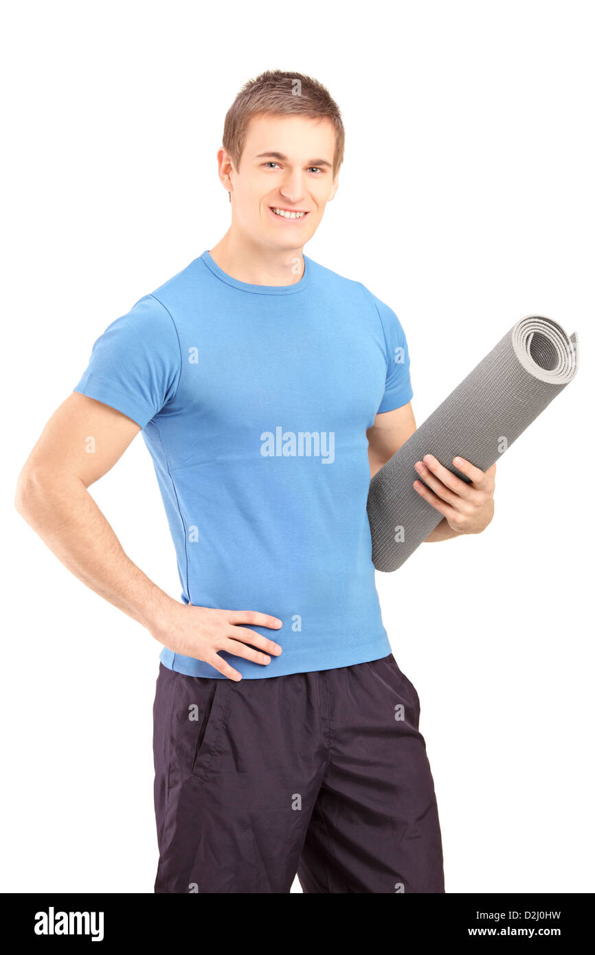 A male athlete holding a mat isolated on white background Stock Photo ...
