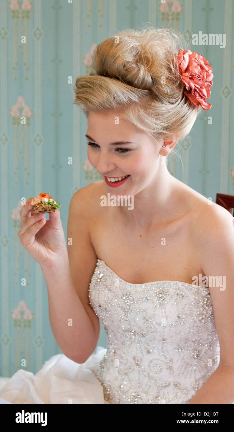 Two attractive young women wearing formal dresses are smiling. Vertical ...