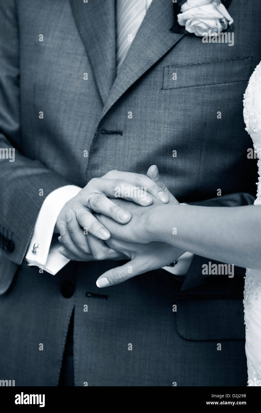 Newly married pair. Female hand in man's hands Stock Photo - Alamy