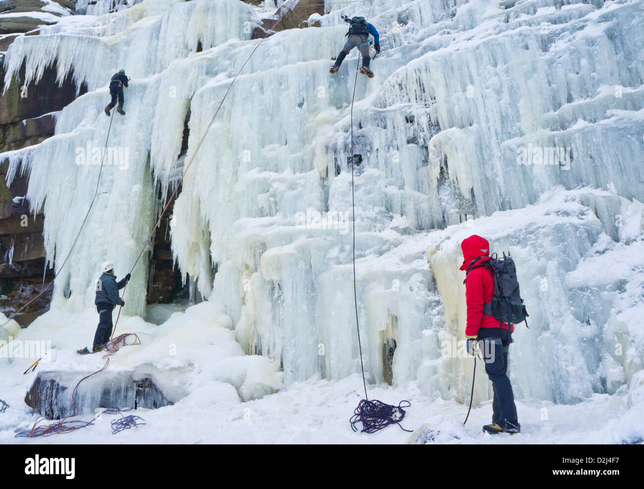 English Peak District, UK. 25th January 2013. Ice climbers climbing a ...