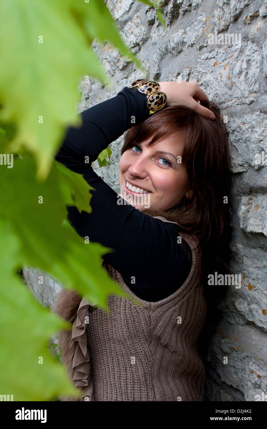 Beautiful Blue Eyed Smiling Girl Outdoors Near The Wall And Maple Stock
