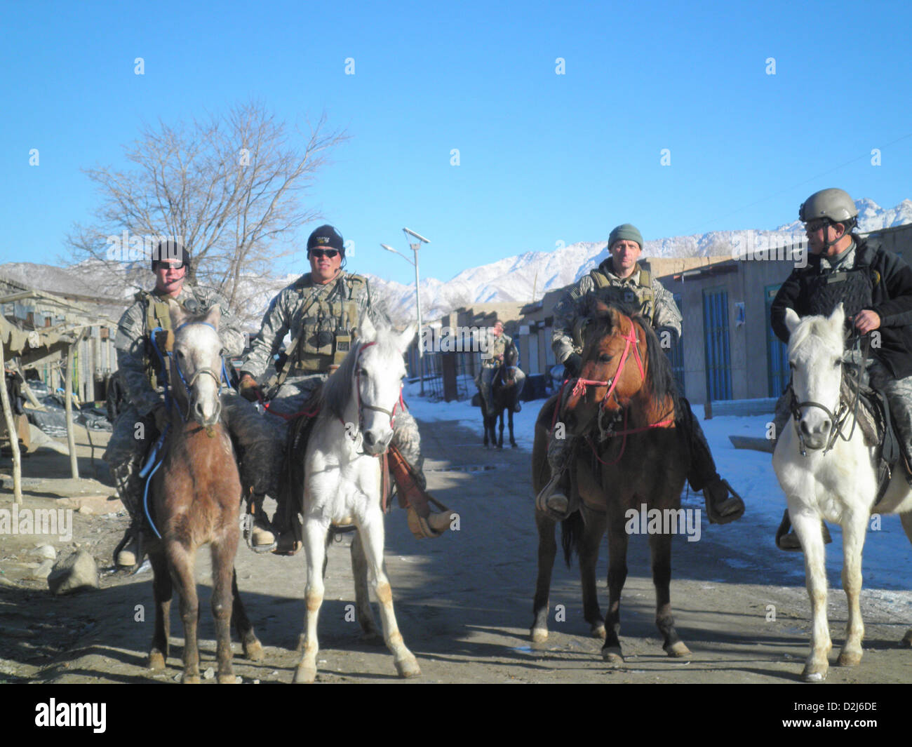 US Special Forces patrol on horseback through a village January 16 ...