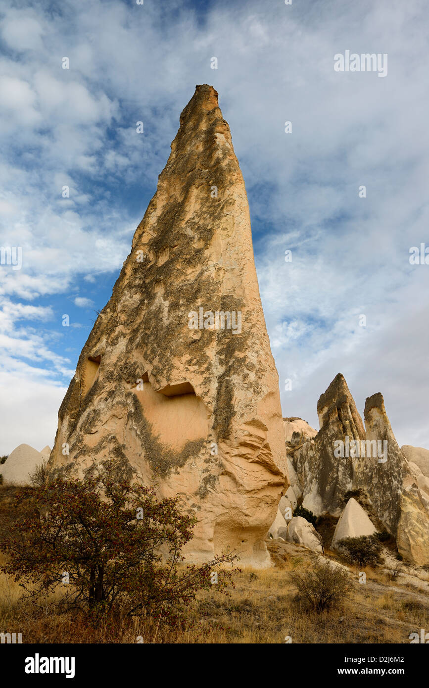 Pointed Rock spires of the Red Valley with cave house Cappadocia Turkey ...