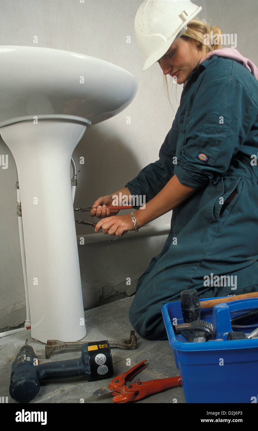 young female plumber plumbing sink Stock Photo - Alamy
