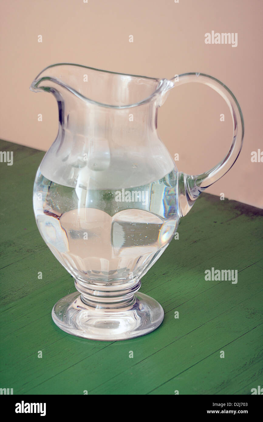 jug of water on old table Stock Photo - Alamy