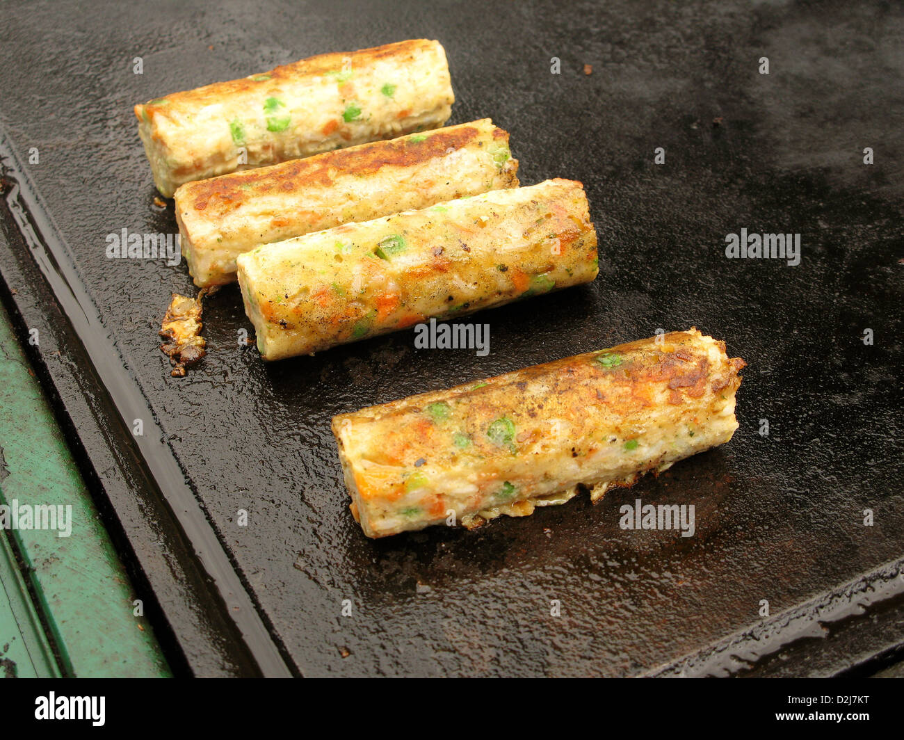 Vegetarian Food cooking on the barbecue hot plates, burgers and ...