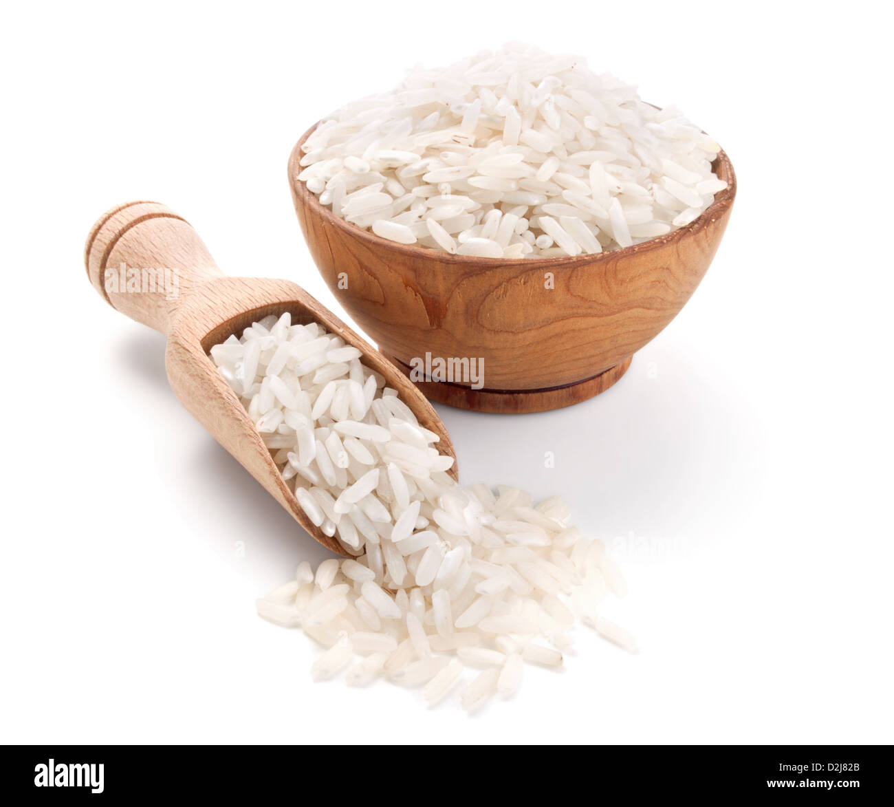 long grain rice in a wooden bowl isolated on white background Stock ...