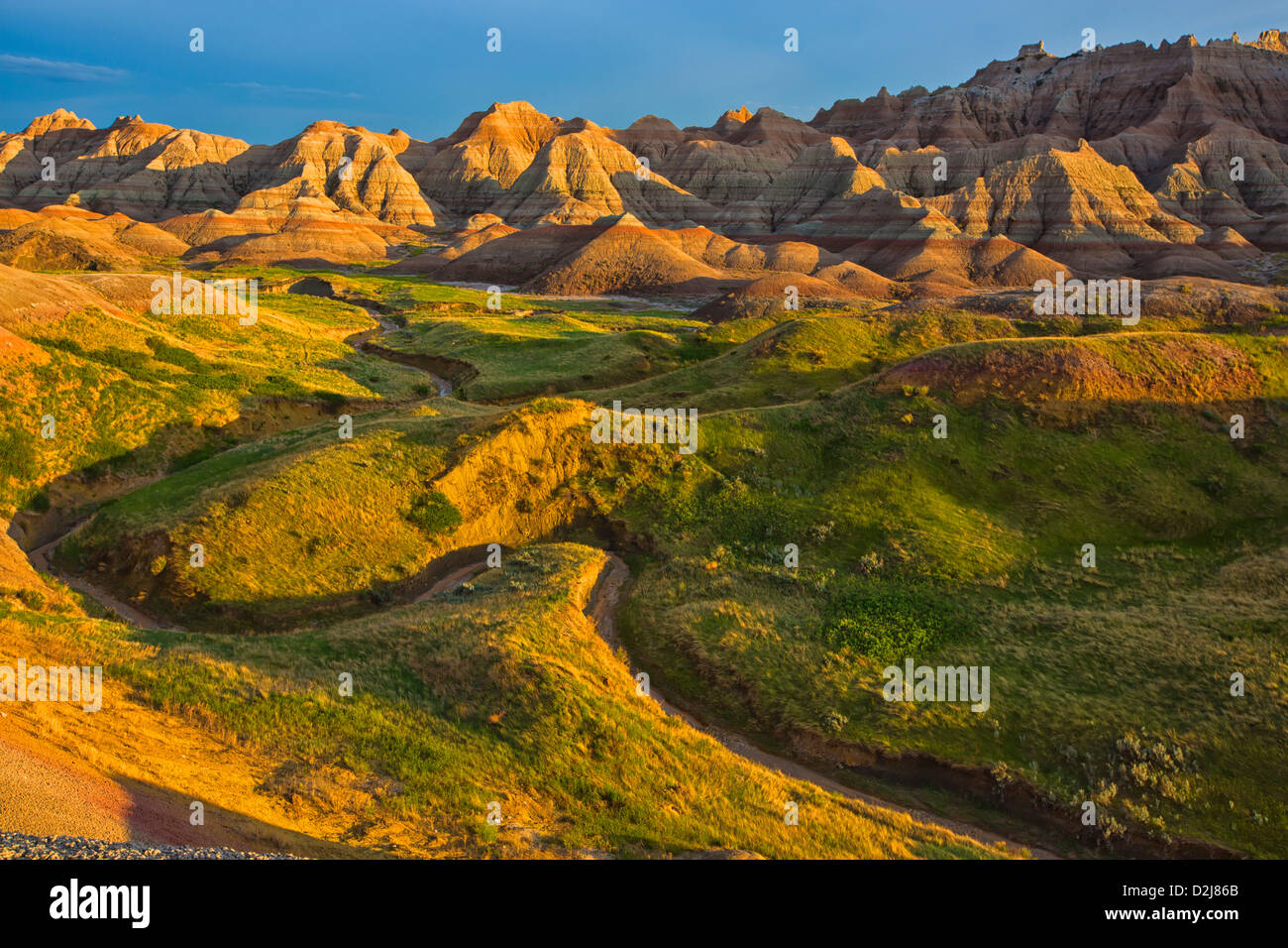 The area called yellow mounds lit by the sunset in badlands national ...
