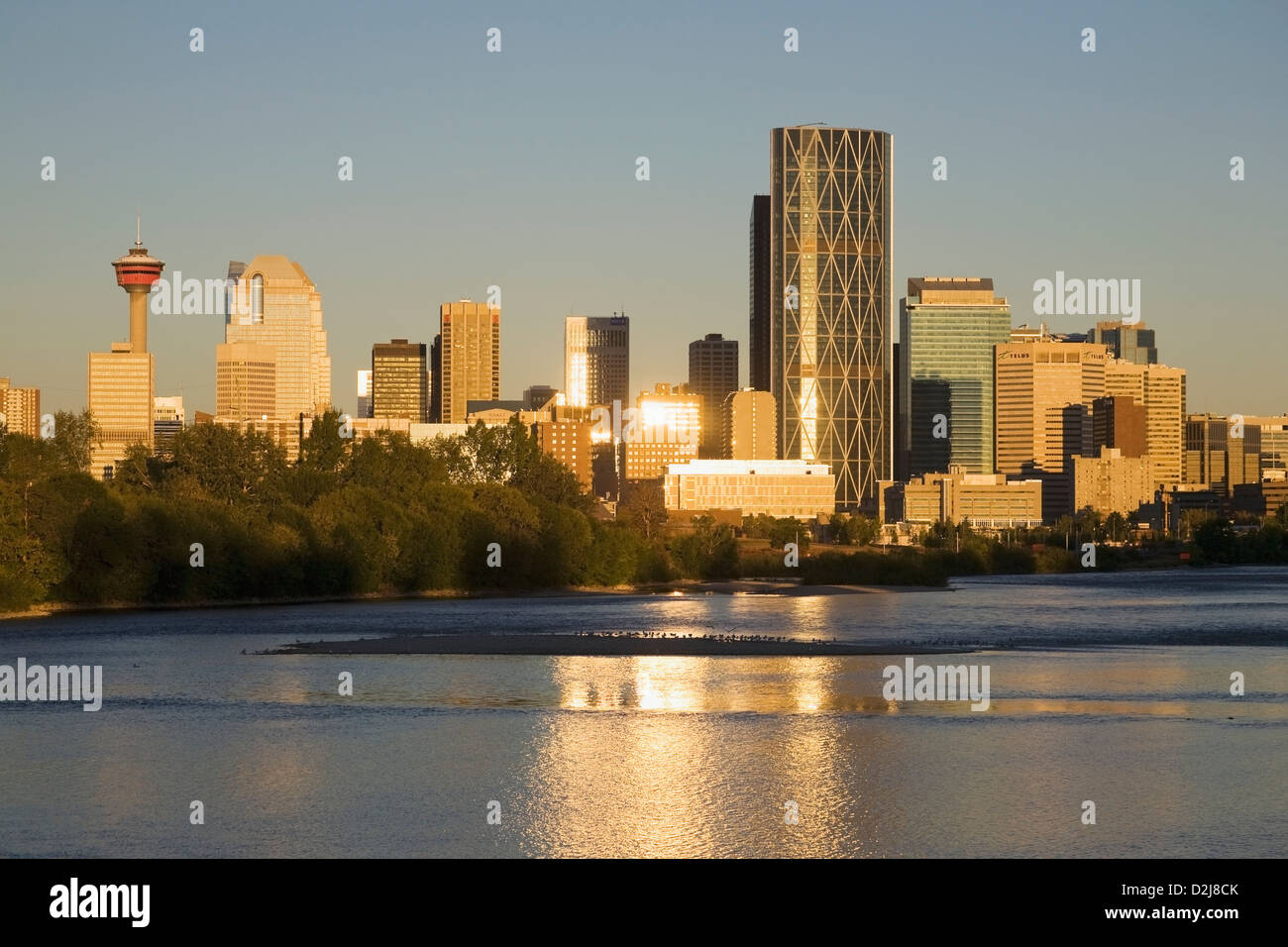 Calgary cityscape along river with reflections on building and river at ...