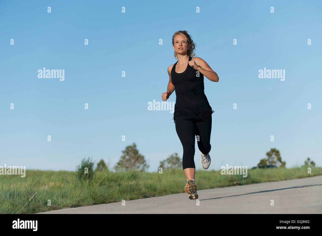 Woman running on a path; arvada colorado united states of america Stock ...
