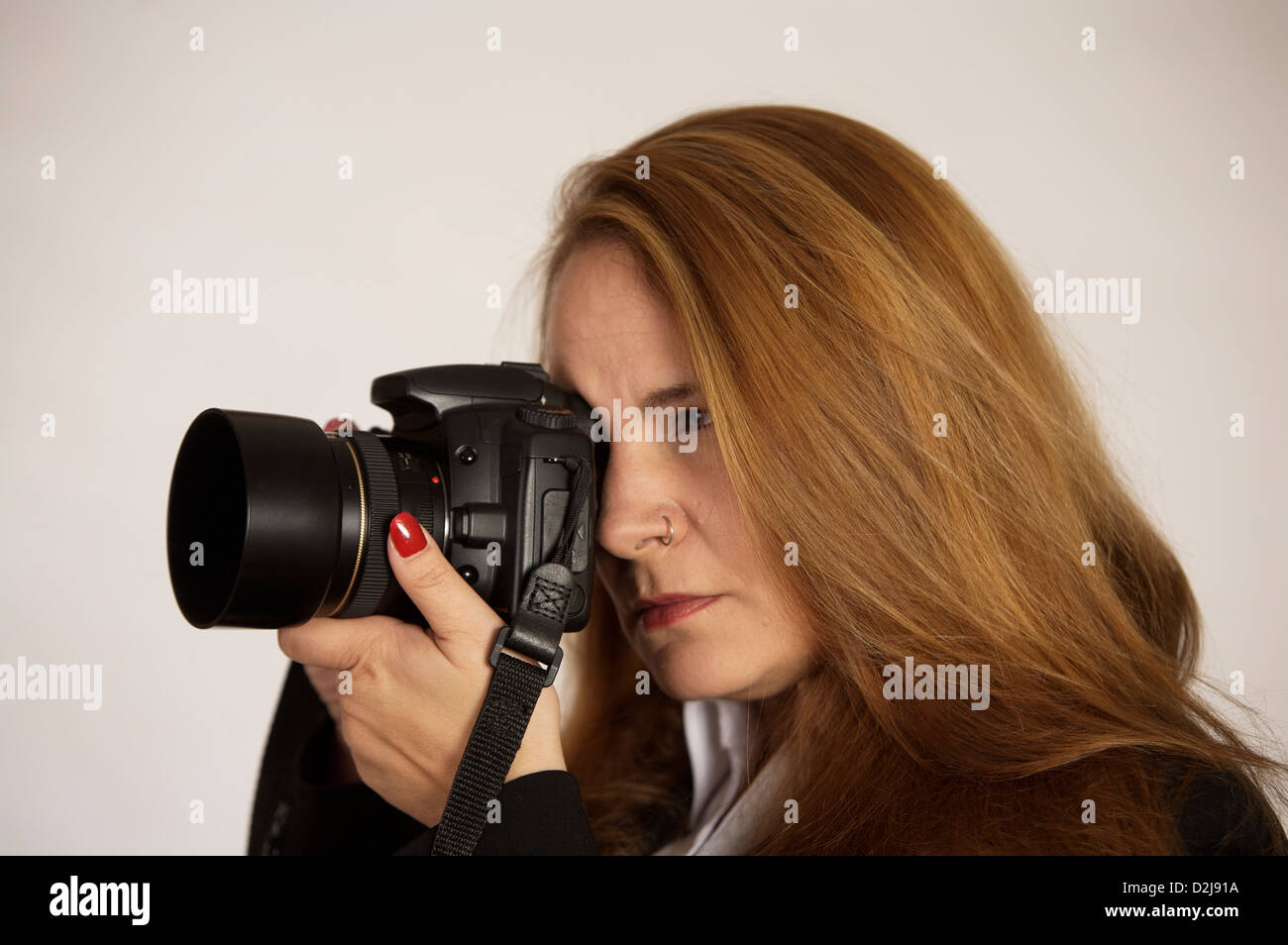Female photographer with modern digital SLR camera Stock Photo - Alamy
