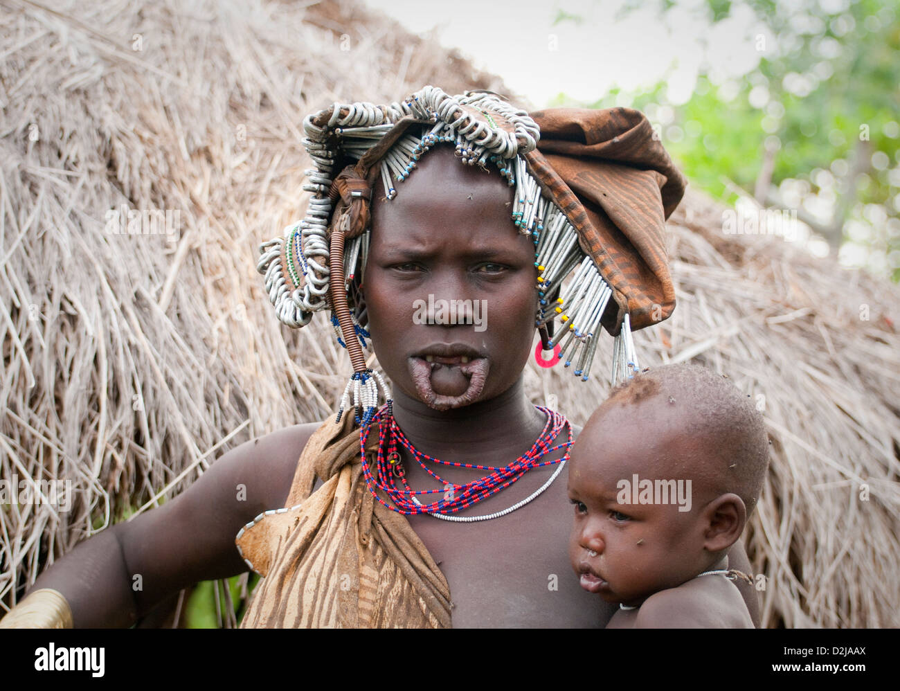 Mursi woman and baby in Omo Valley Stock Photo - Alamy