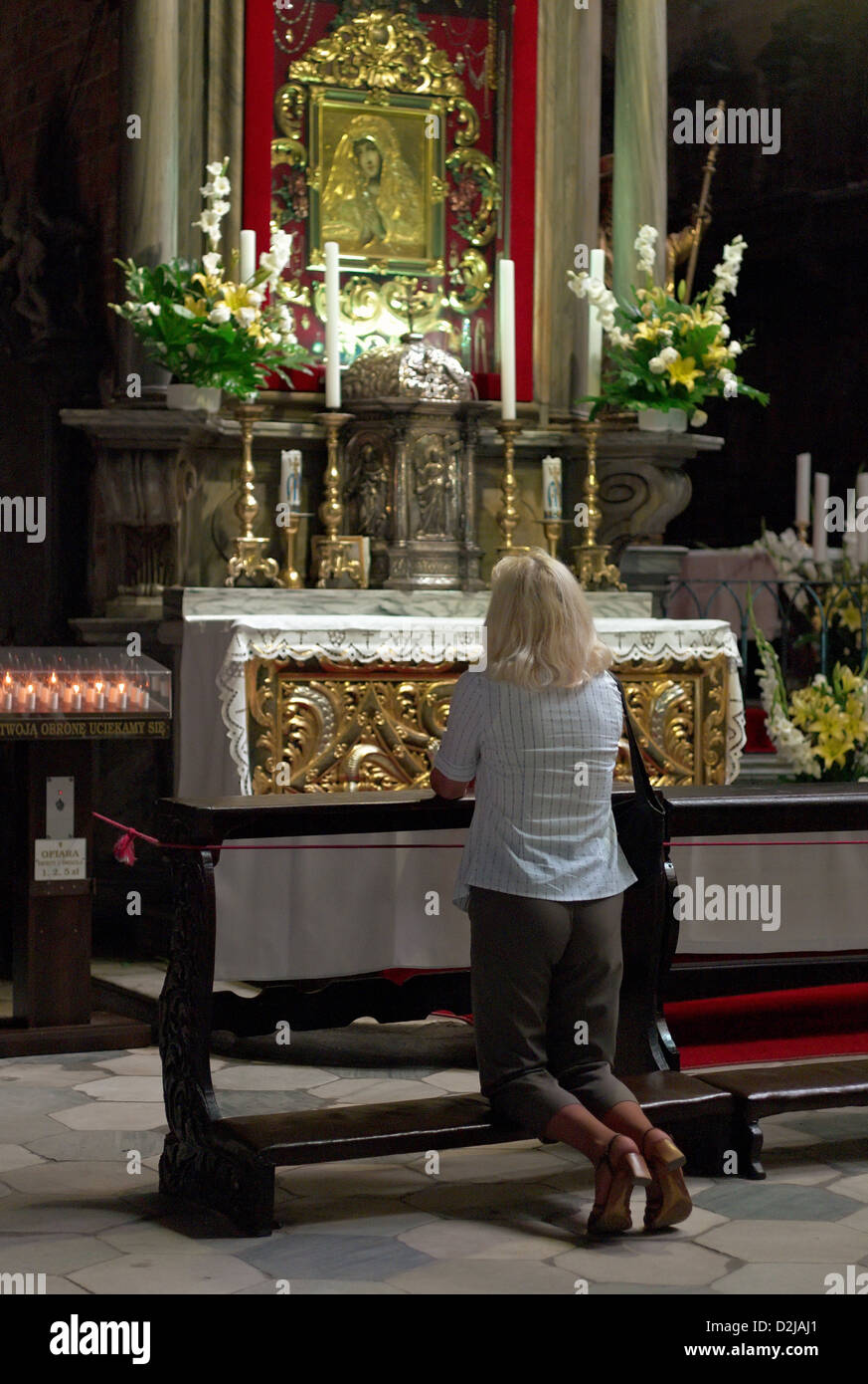 Kneeling In Prayer At Altar
