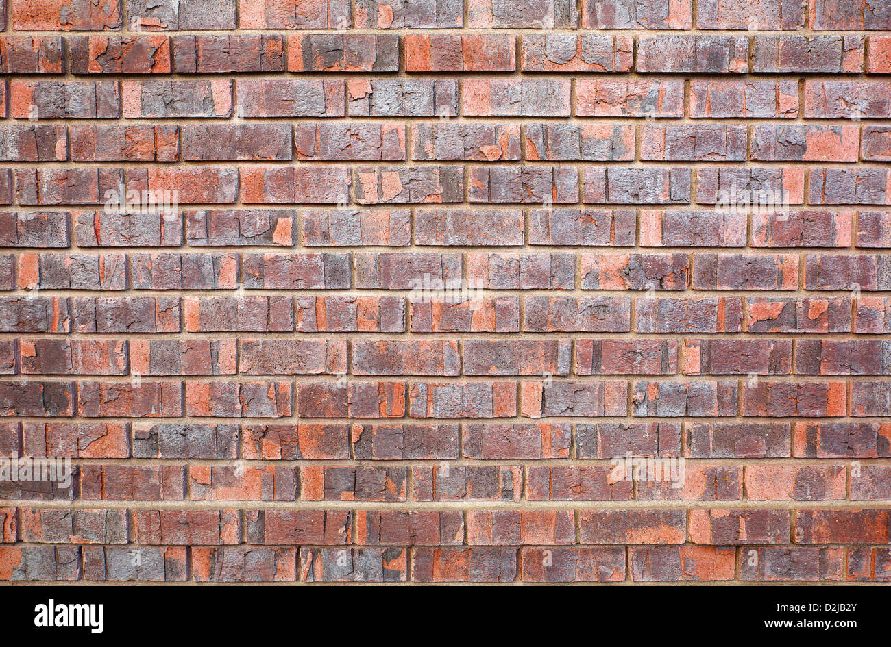 Manufactured red Faux used brick wall Stock Photo - Alamy