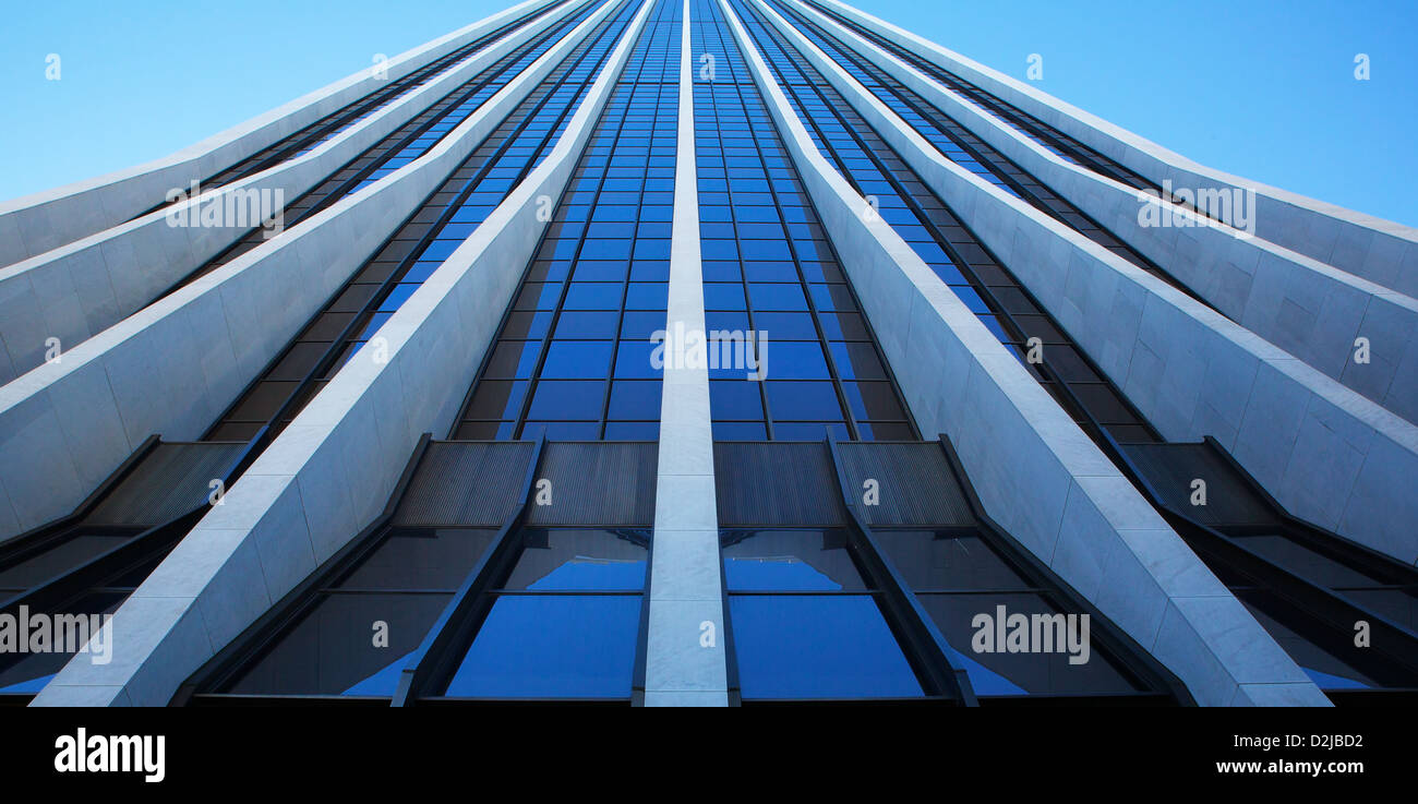 Close up vertical view of modern office building on a clear day that ...
