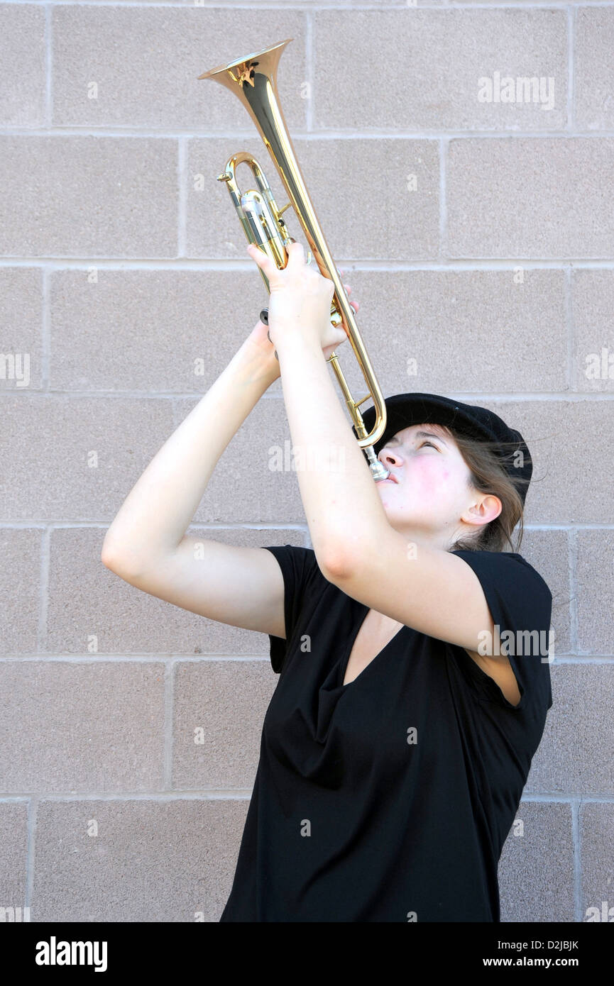Woman blowing trumpet hi-res stock photography and images - Alamy
