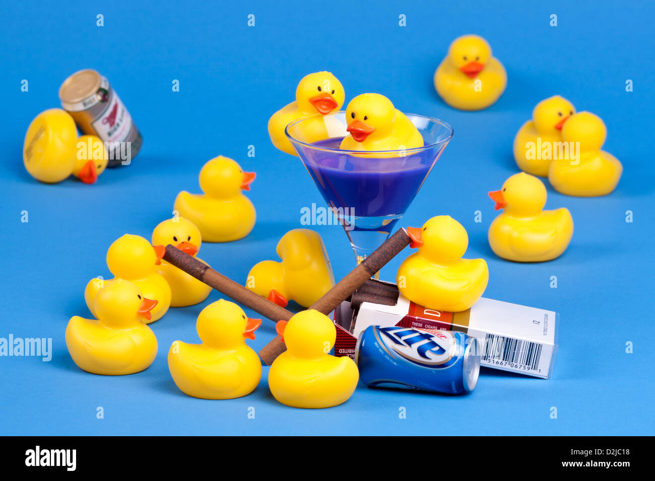Yellow rubber ducks partying with cigars and alcohol Stock Photo - Alamy