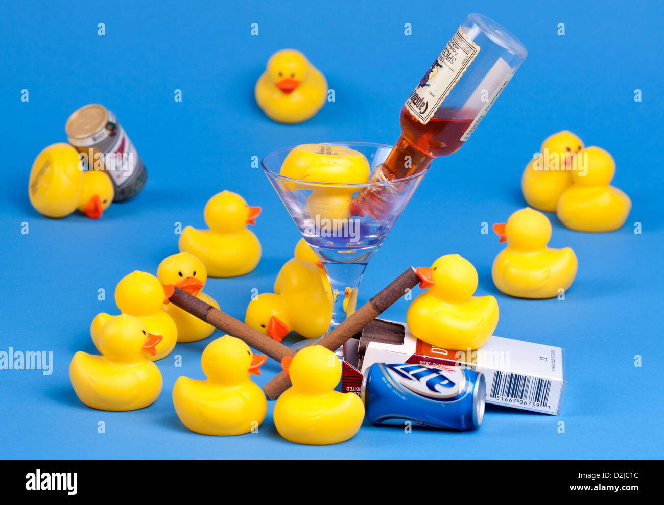 Yellow rubber ducks partying with cigars and alcohol Stock Photo - Alamy