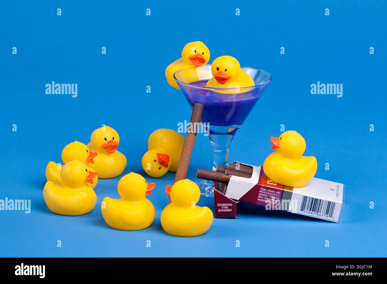 Yellow rubber ducks partying with cigars and alcohol Stock Photo - Alamy