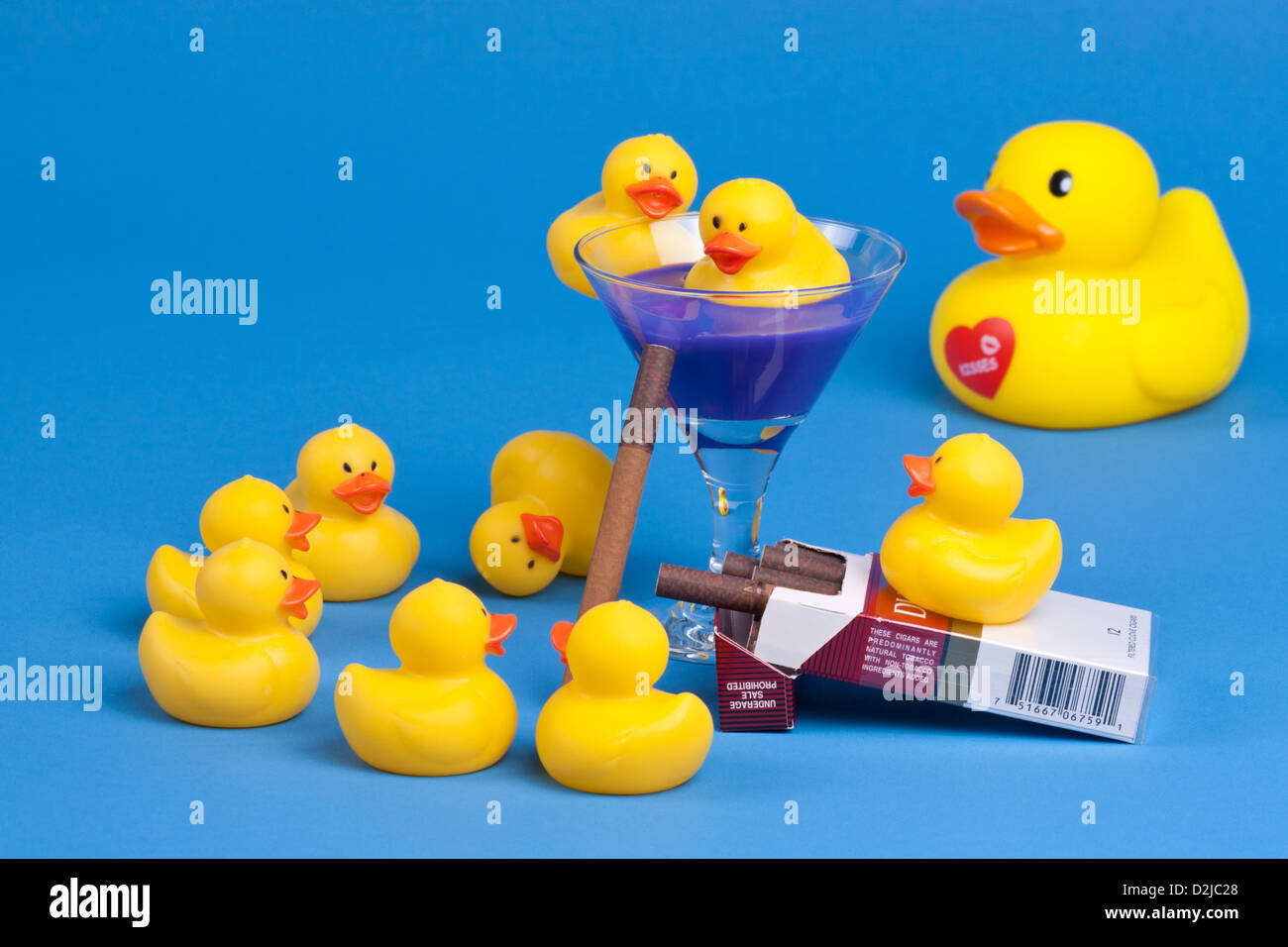 Yellow rubber ducks partying with cigars and alcohol Stock Photo - Alamy