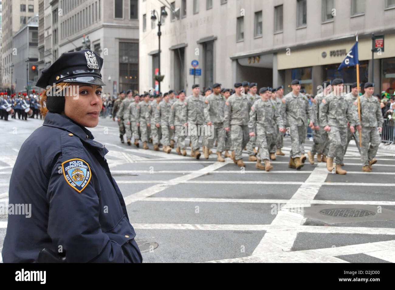 New York City, USA, a cop on the edge of the parade and marching UNSCDF ...