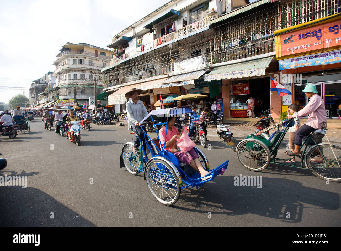Phnom Penh, Cambodia, Cyclos on a street Stock Photo - Alamy