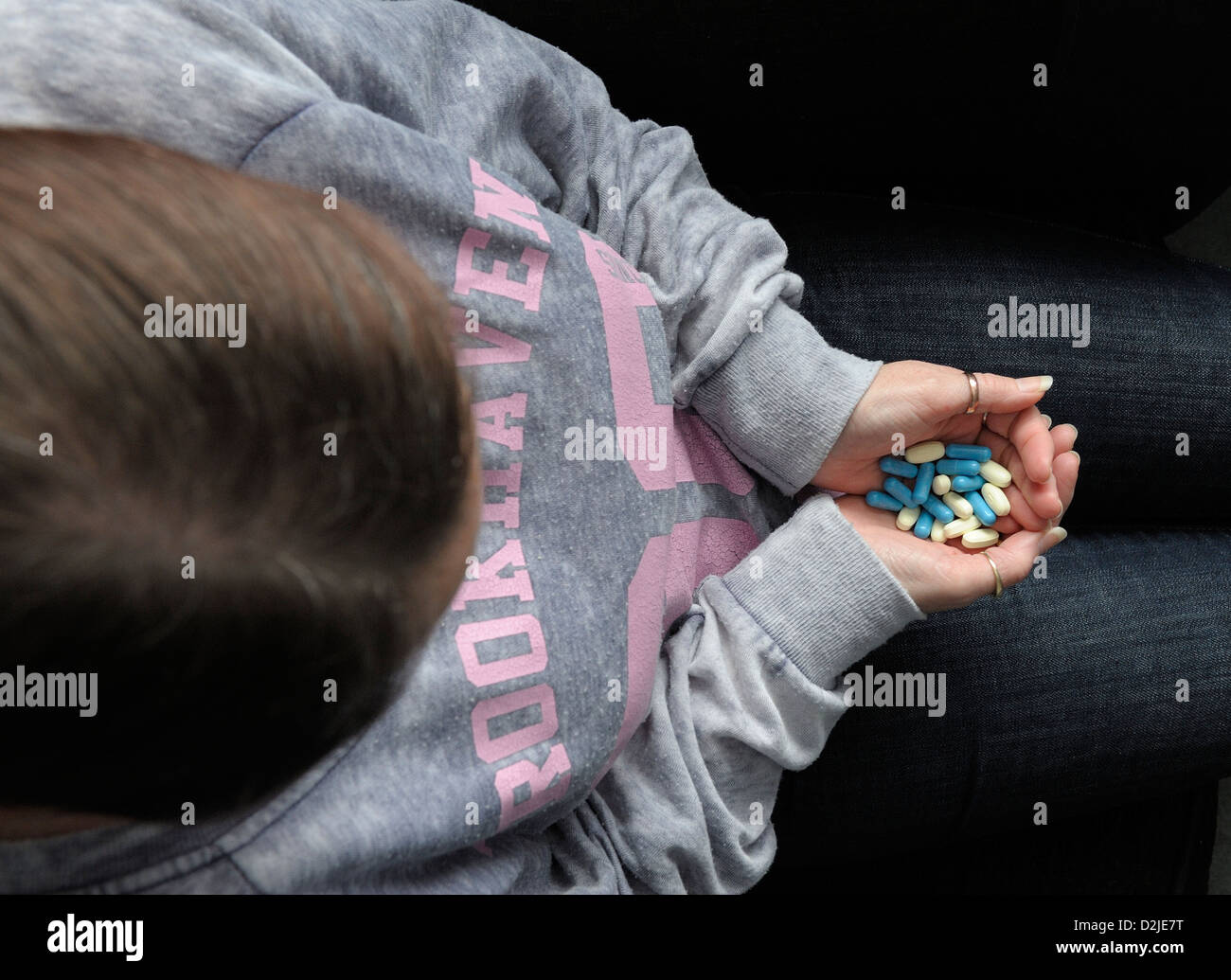 female holding a selection of prescription tablets Stock Photo - Alamy