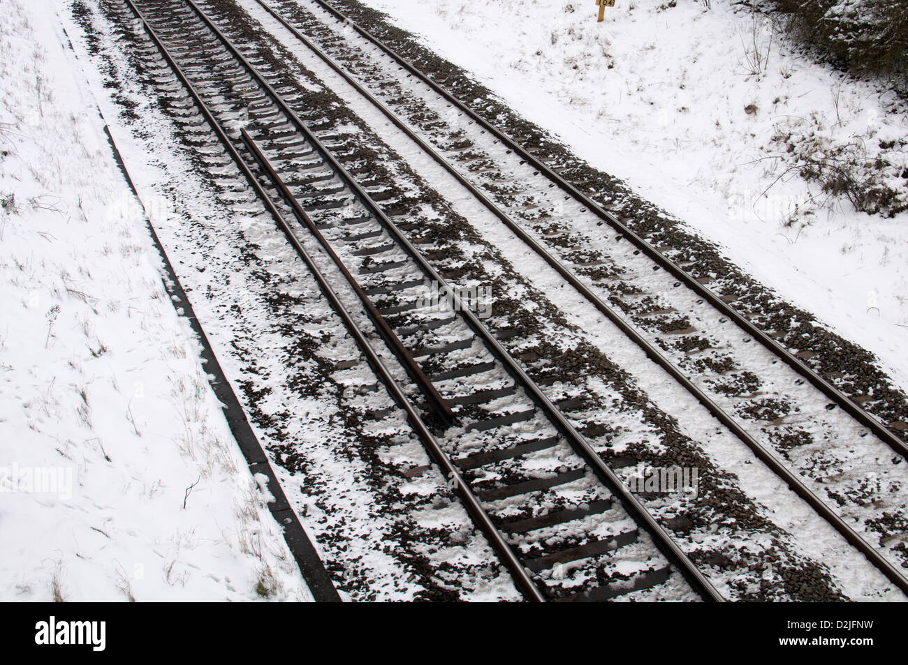 Railway tracks with snow Stock Photo - Alamy
