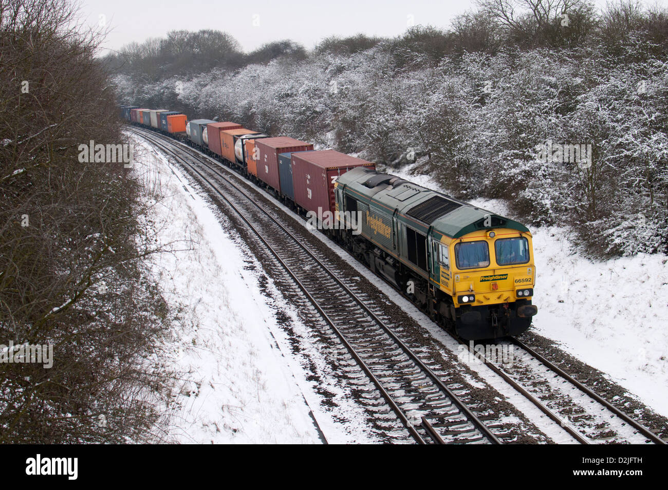 Freightliner train in winter passing through Whitnash cutting Stock ...
