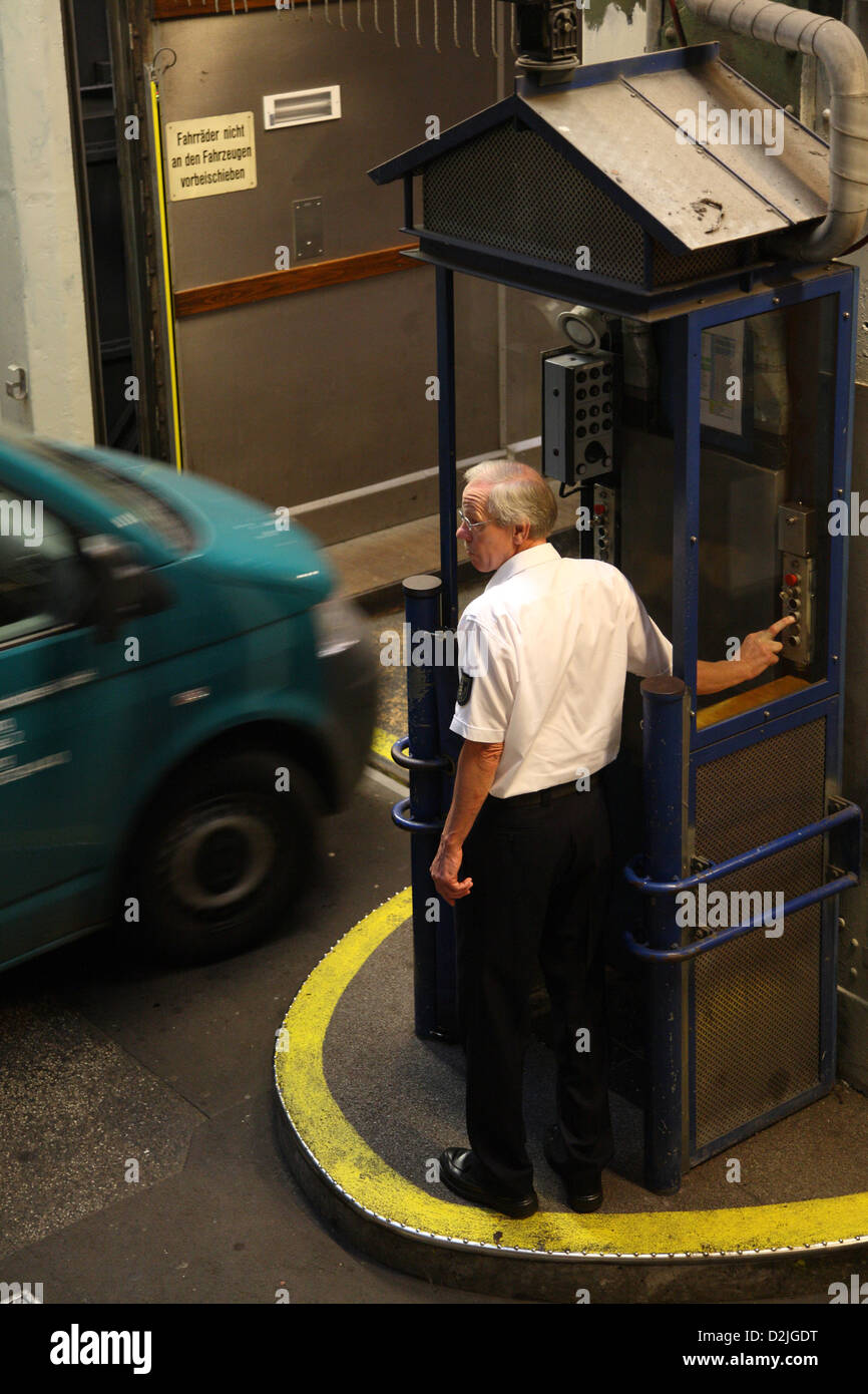 Hamburg, Germany, operates the tunnel guards lifts for cars in the Old ...