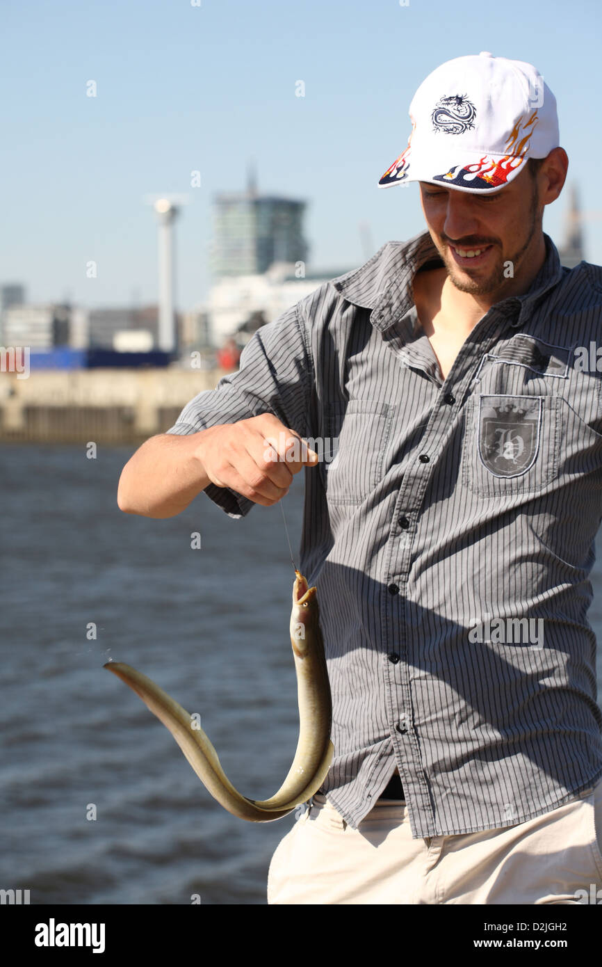 Hamburg, Germany, an angler with an eel in Freeport Stock Photo - Alamy