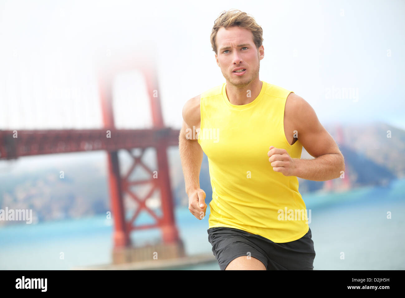 Male athlete runner working out jogging by Golden Gate Bridge, San ...