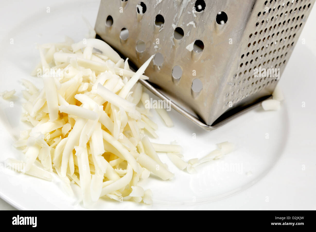goats cheese after processing through a cheese-grater Stock Photo - Alamy