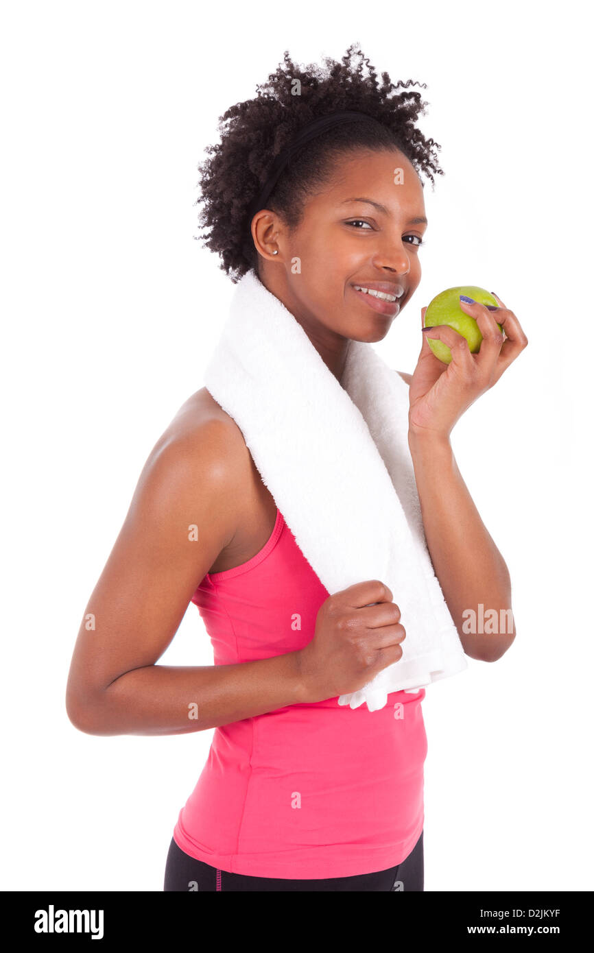 Young african american woman eating an apple over white background ...