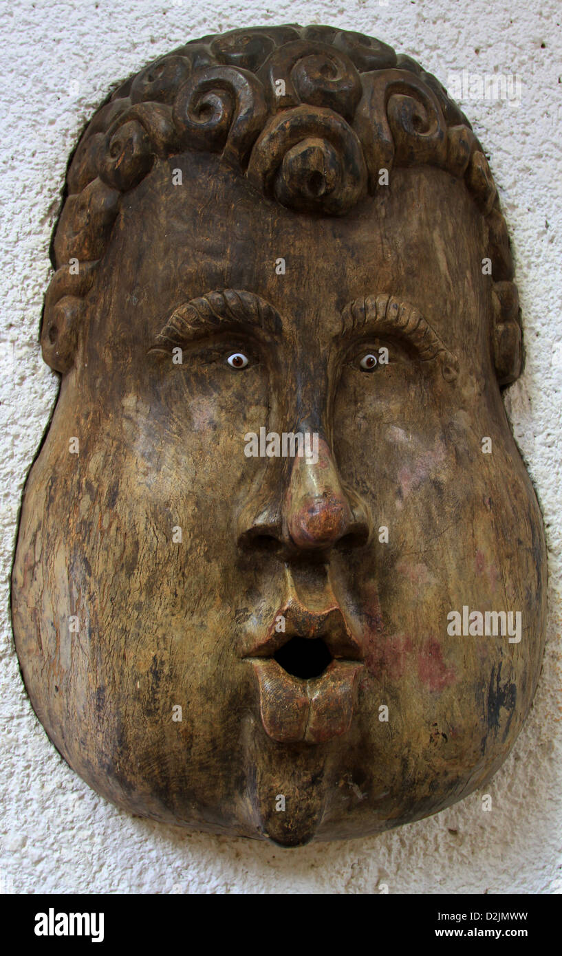 Tactile rubbed polished wood surface, round fat faced guy, pear shaped ...