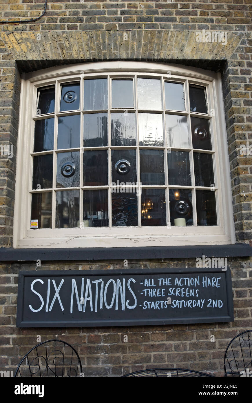 chalked sign advertising six nations international rugby on three ...