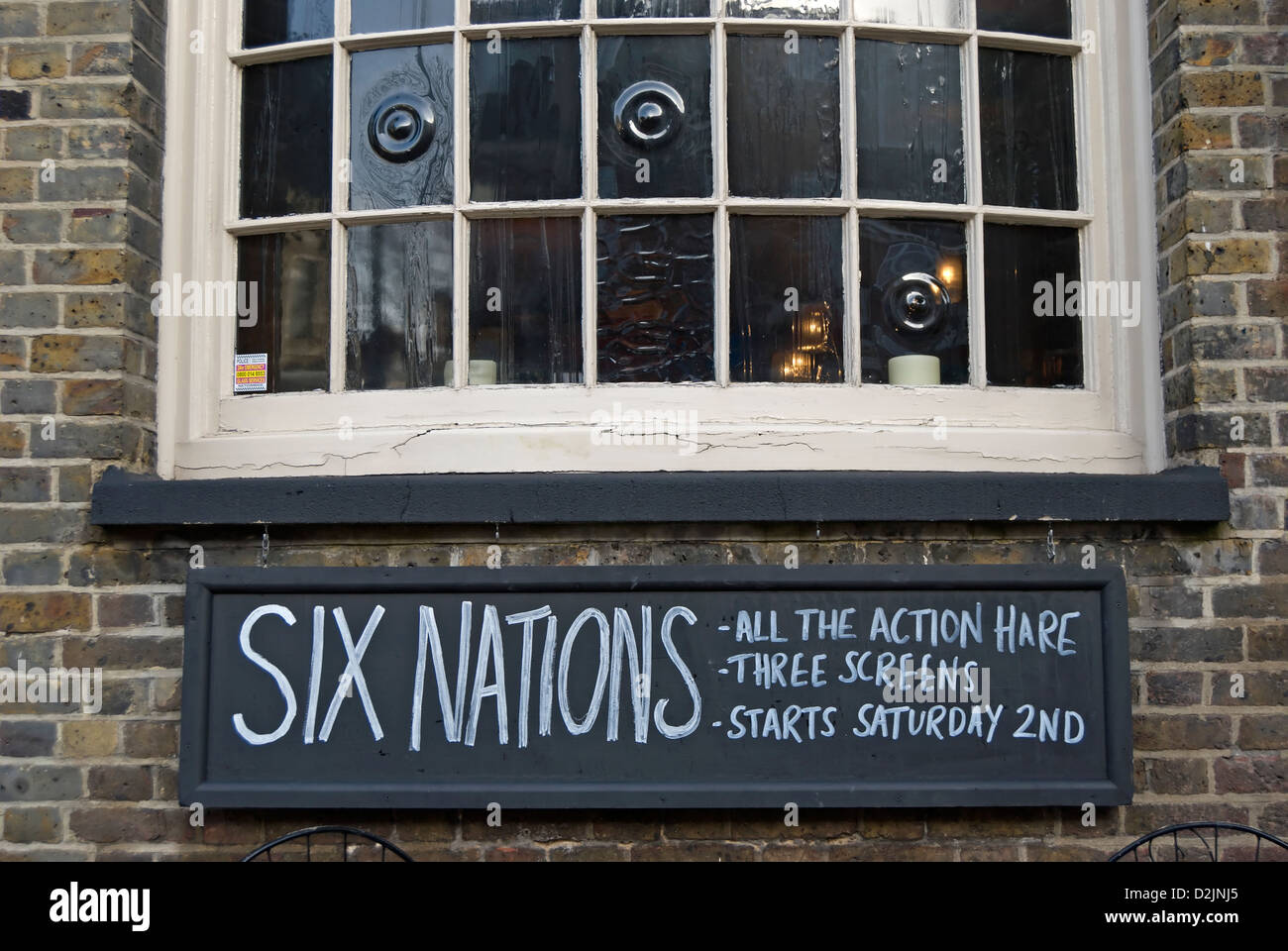 chalked sign advertising six nations international rugby on three ...